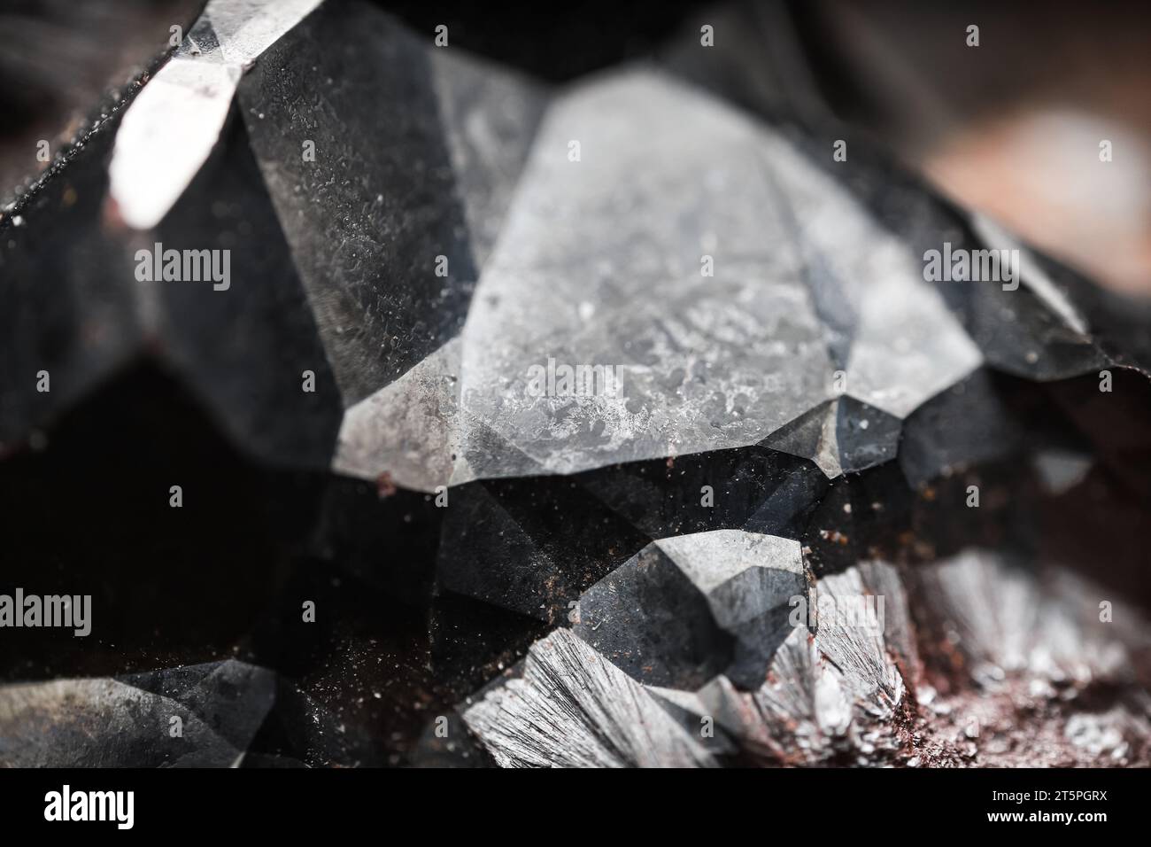 Metal rock texture. Close up of a raw hematite stone. Shiny mineral ...