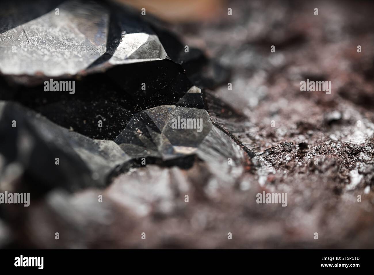 Metal rock texture. Close up of a raw hematite stone. Shiny mineral ...