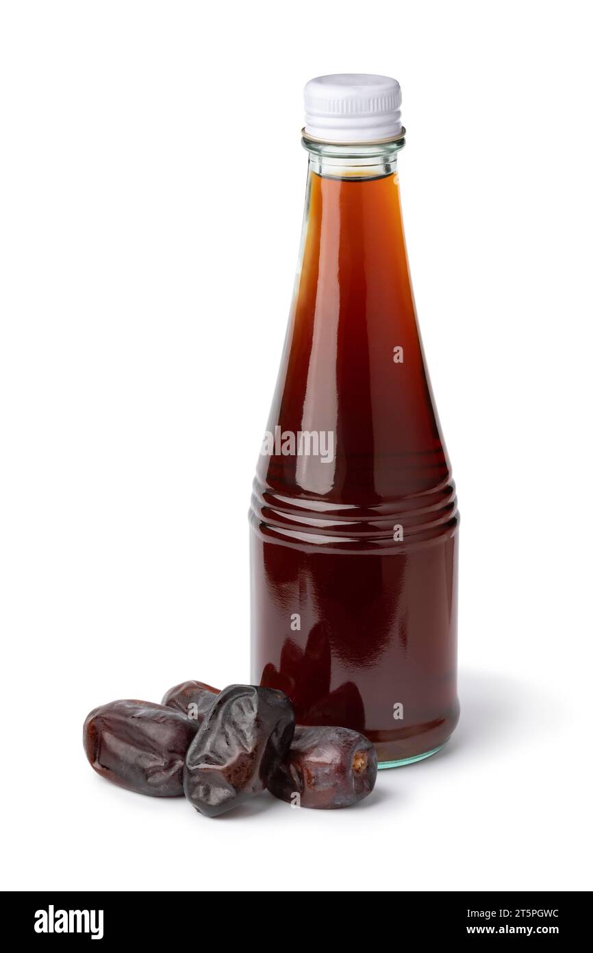 Glass bottle with date vinegar and dried dates in front isolated on ...