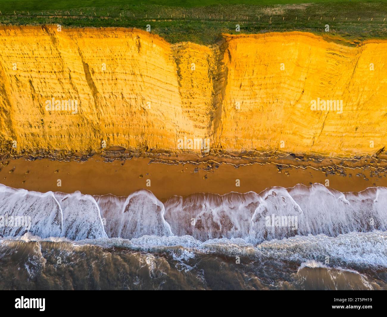 West Bay, Dorset, UK. 6th November 2023. UK Weather. Aerial view of the beach and cliffs at West ...