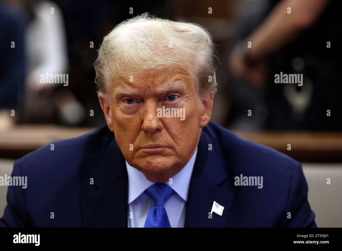 Former President Donald Trump waits to take the witness stand during ...