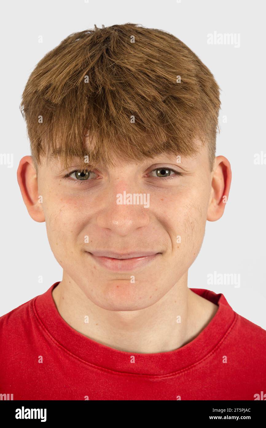A studio portrait of a happy fifteen year old teenage boy Stock Photo ...