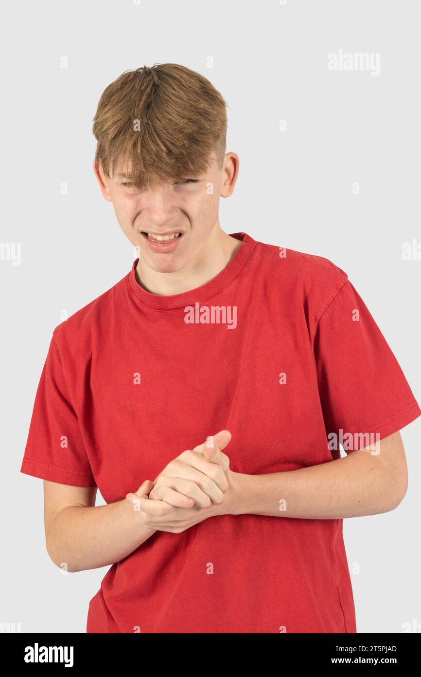 A studio portrait of a disgusted fifteen year old teenage boy Stock ...