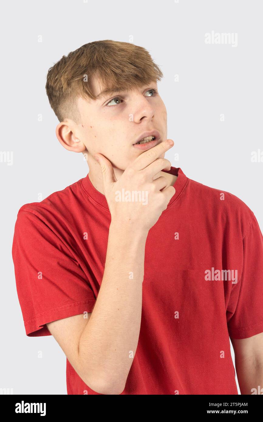A studio portrait of a fifteen year old teenage boy thinking Stock ...