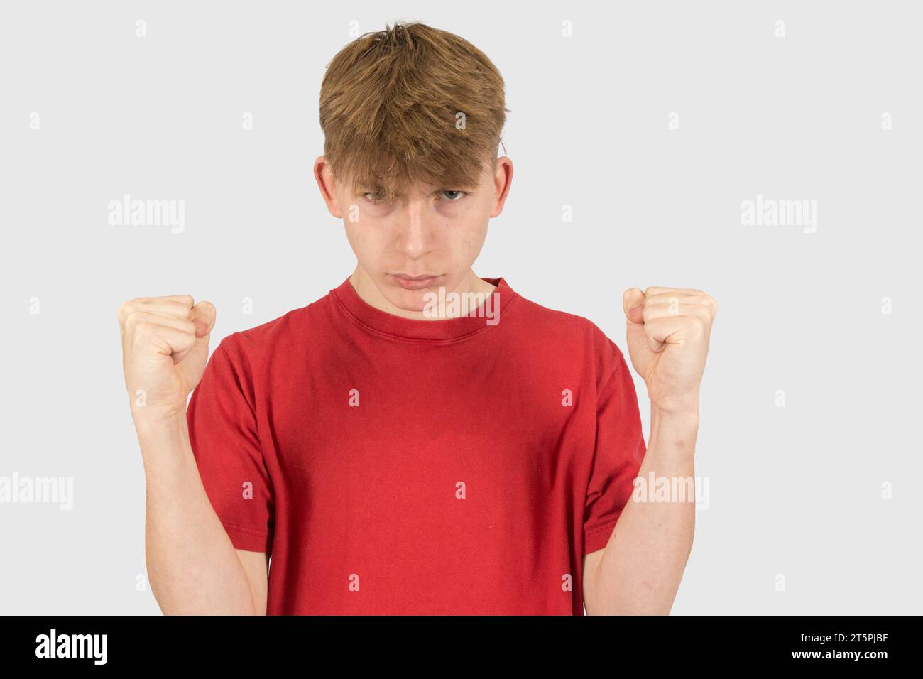 A studio portrait of a sulky fifteen year old teenage boy Stock Photo ...