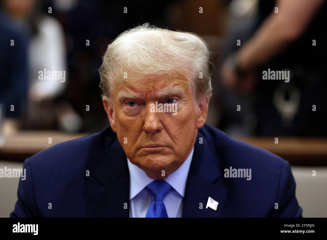Former President Donald Trump waits to take the witness stand during ...