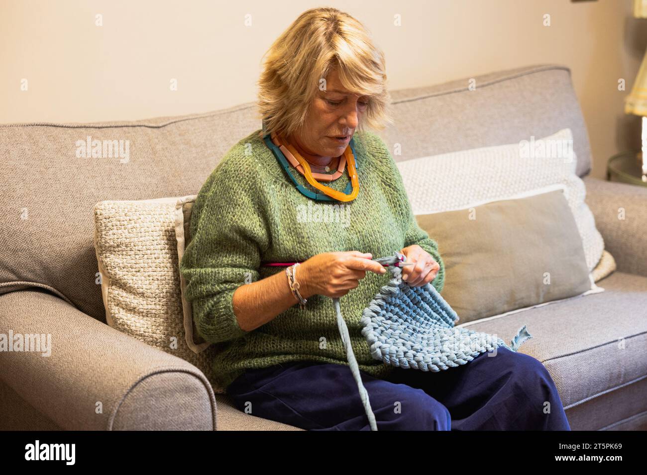Old woman sitting knitting grandmother hi-res stock photography and ...