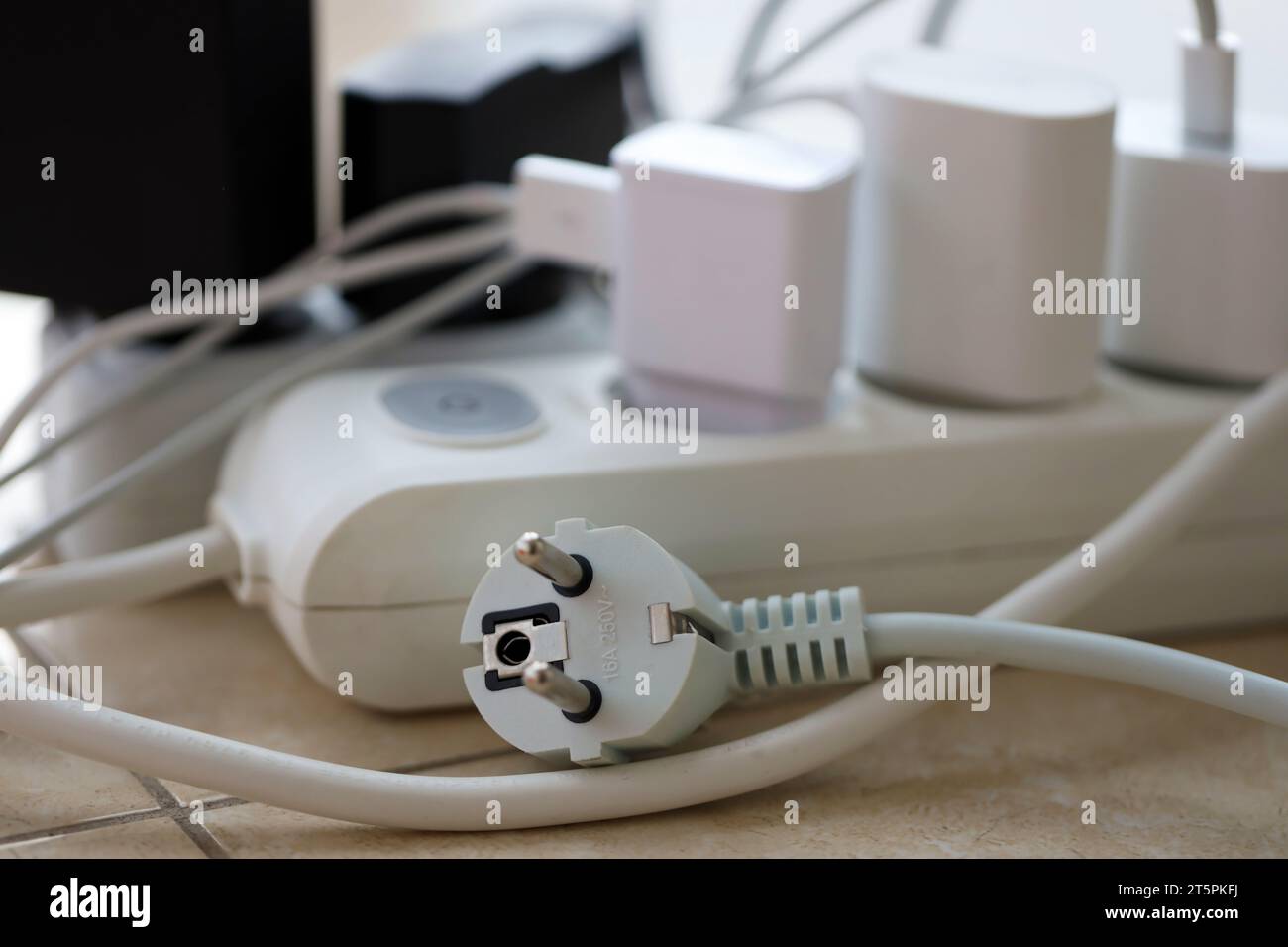 Overloaded power boards. Power strips with different electrical plugs ...