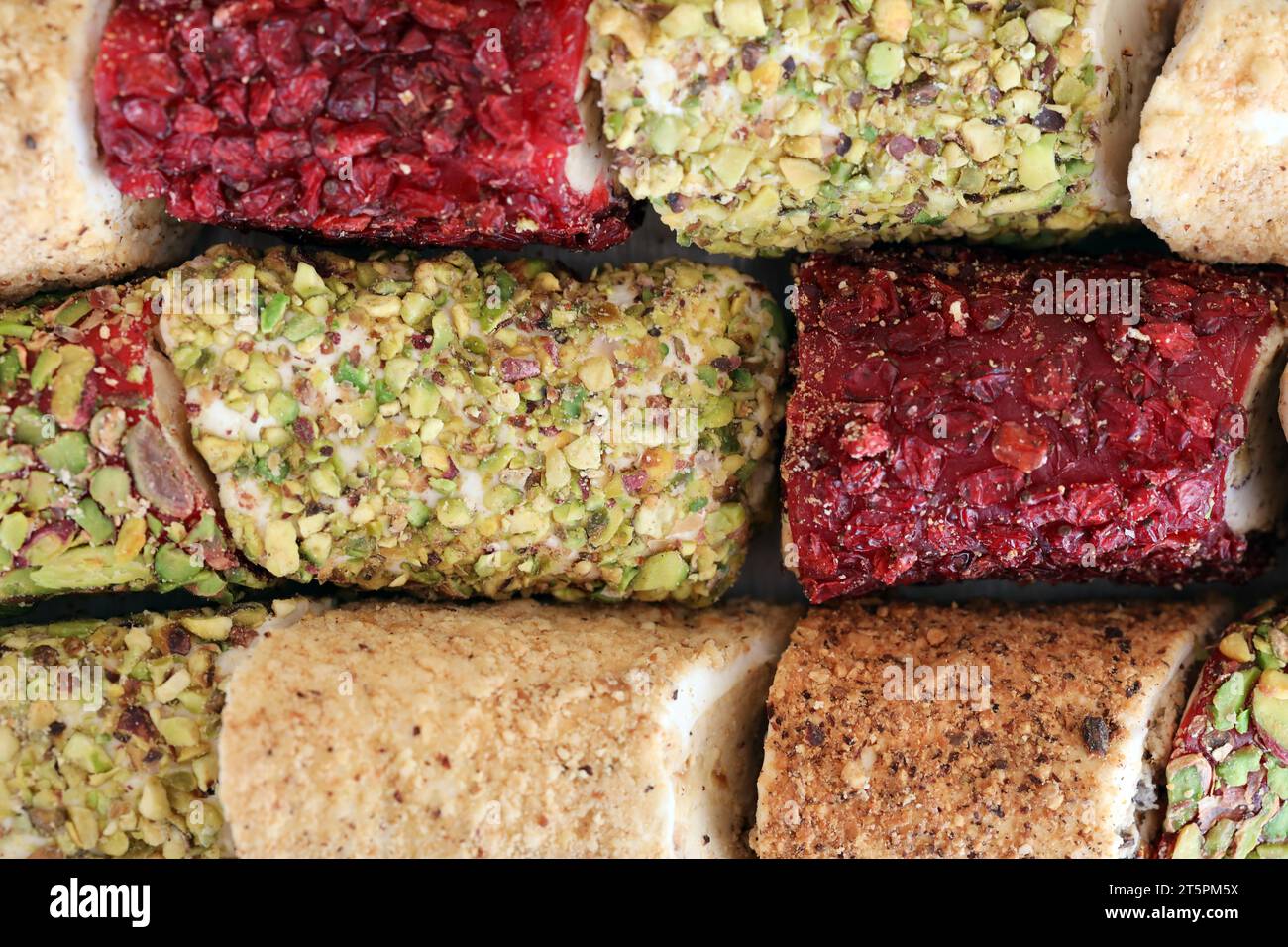 Rolls of turkish delight with many different flavors and fillings close ...