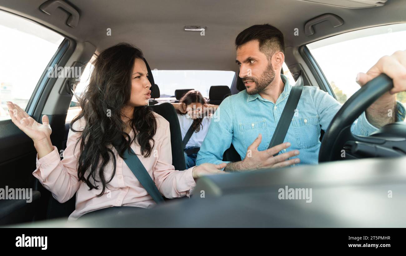 Caucasian couple arguing in car, distressed child in backseat Stock ...