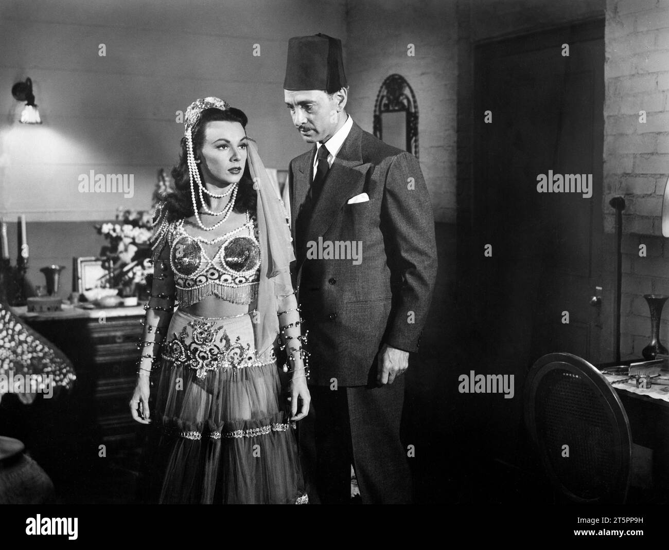 Lisa Ferraday, Donald Randolph, on-set of the film, "Flame of Stamboul ...