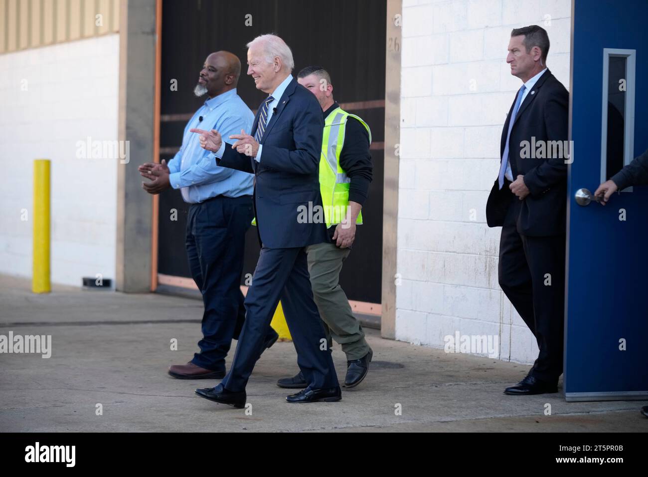 President Joe Biden walks to tour the Amtrak Bear Maintenance Facility ...