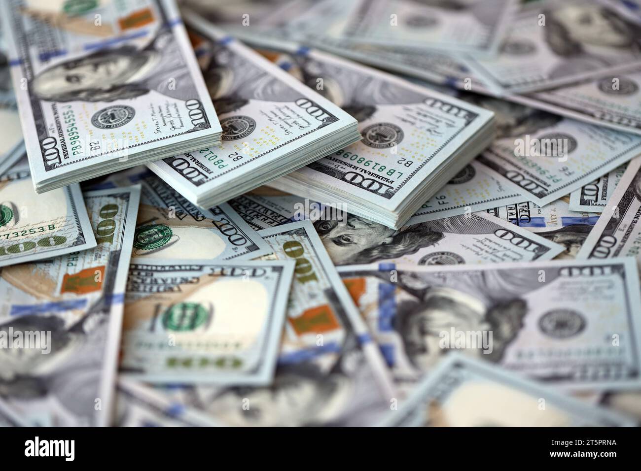 Very big amount of US hundred dollar bills close up. Huge quantity of ...
