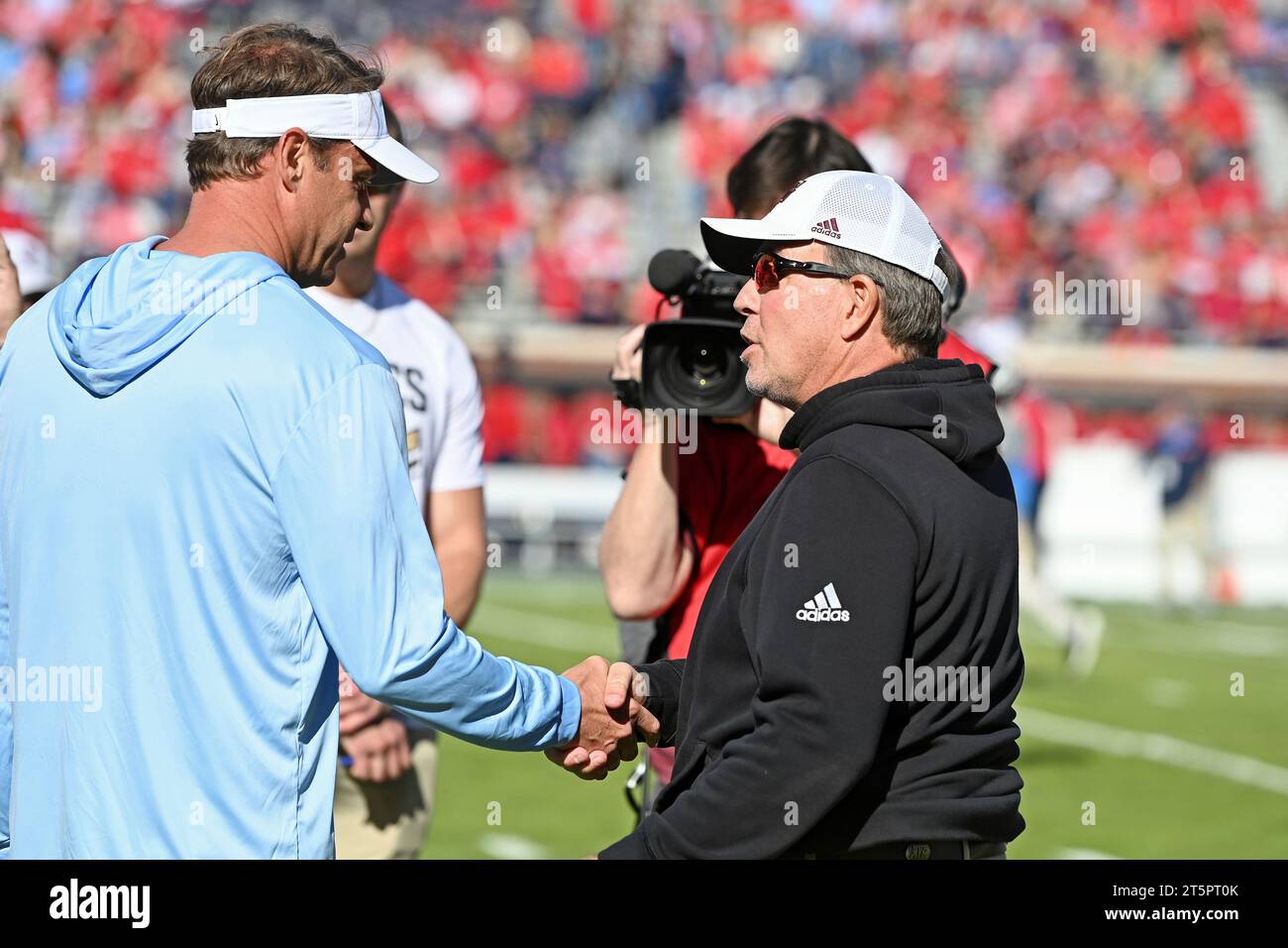 Mississippi head coach Lane Kiffin, left, and Texas A&M head coach ...