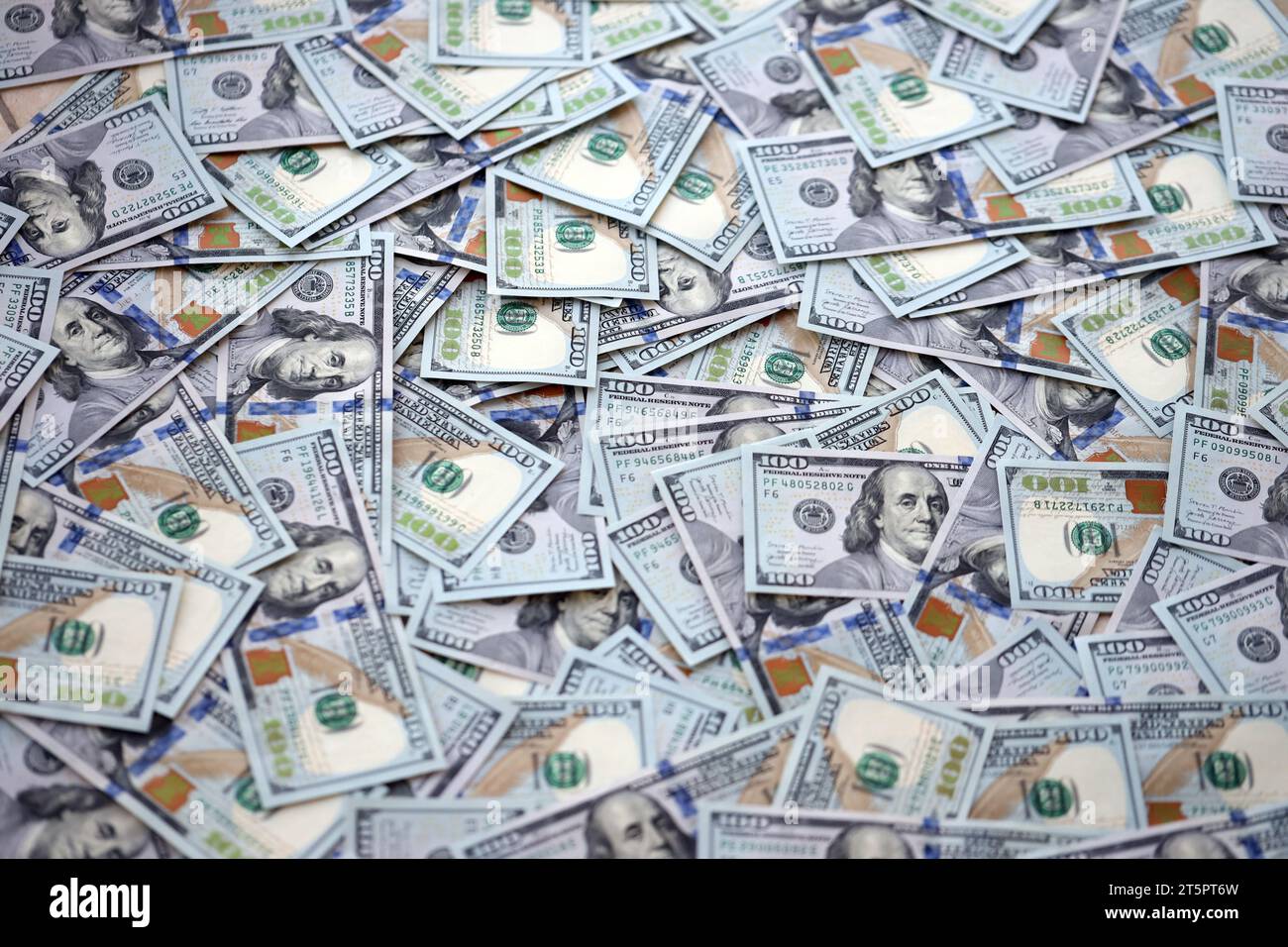 Very big amount of US hundred dollar bills close up. Huge quantity of ...