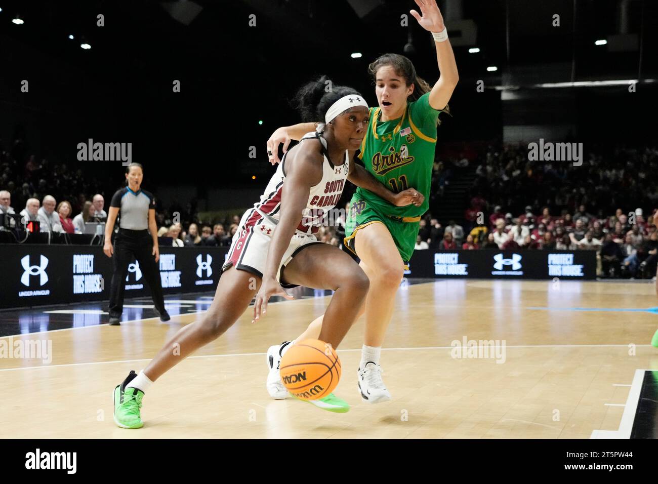South Carolina guard Bree Hall, left, is defended by Notre Dame guard ...