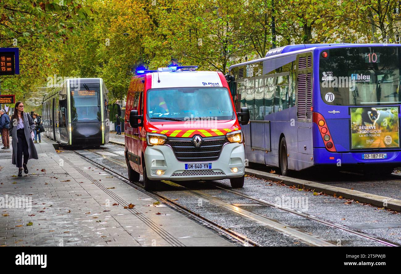 Emergency SAMU vehicle weaving through bus and tram lanes in city ...