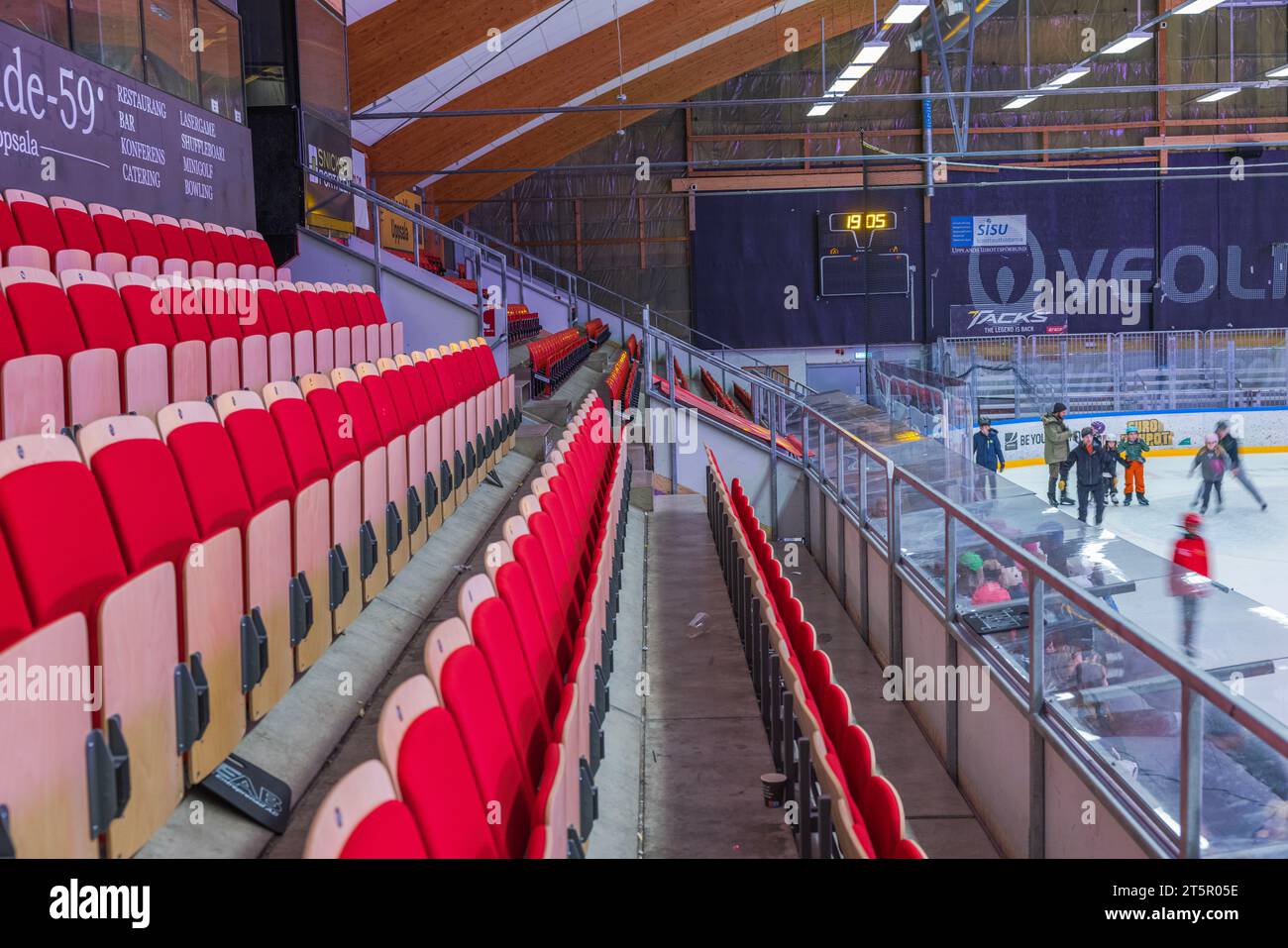 View of sports complex with seating stands and an ice skating rink ...