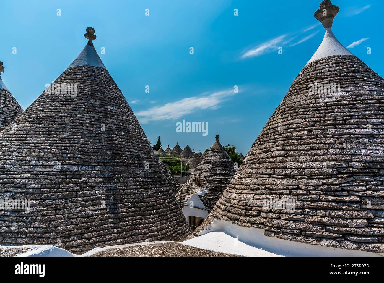 A view of the conical roofs of Trulli buildings in Alberobello, Bari ...