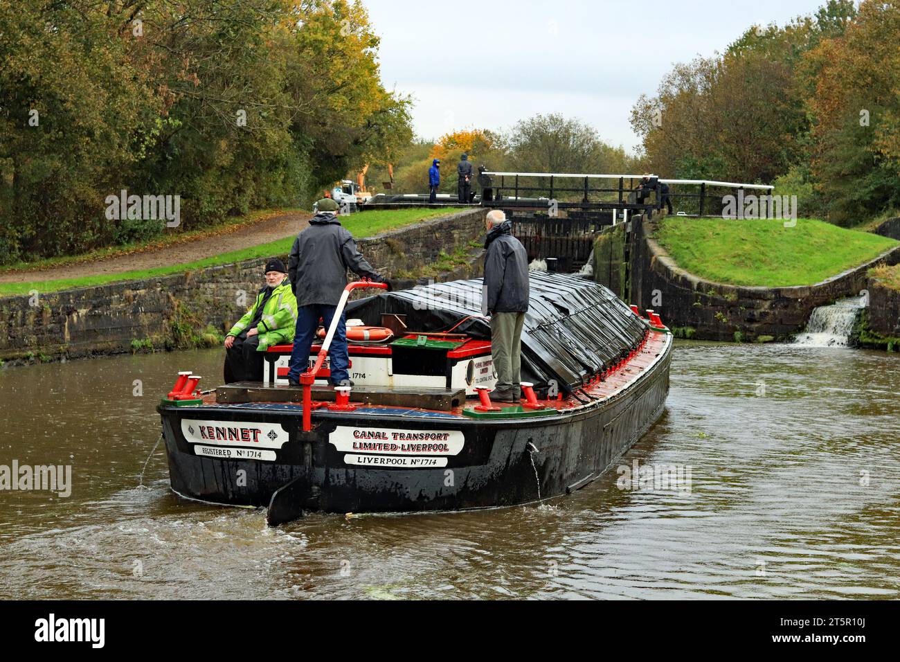 A barge, the “Kennet” makes its way up the flight of canal locks from ...