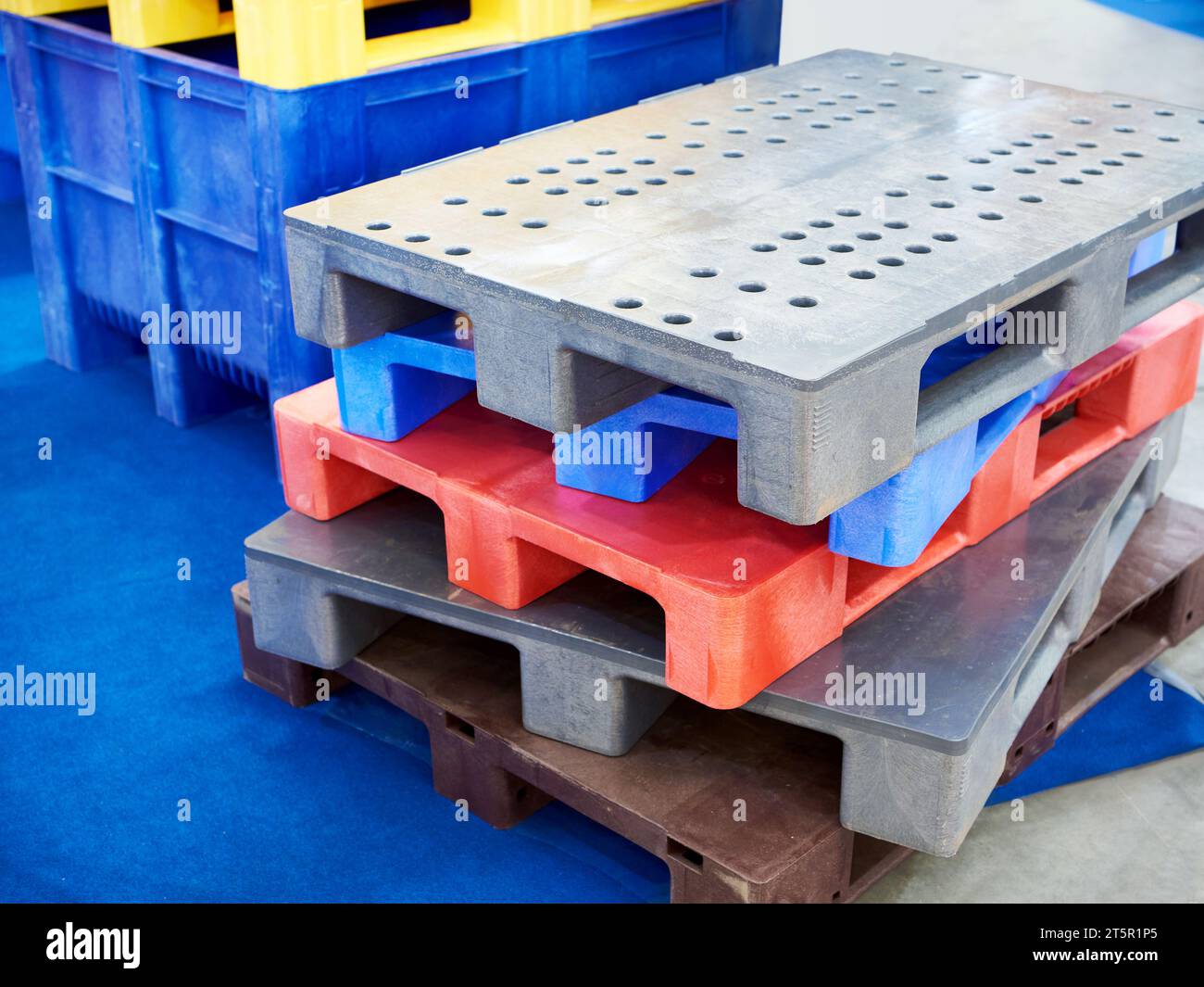 Plastic pallets at the exhibition of fishing equipment Stock Photo - Alamy