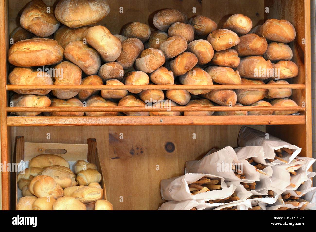 Italian food products, buns of Italian Bread on the shelves of a bakery ...