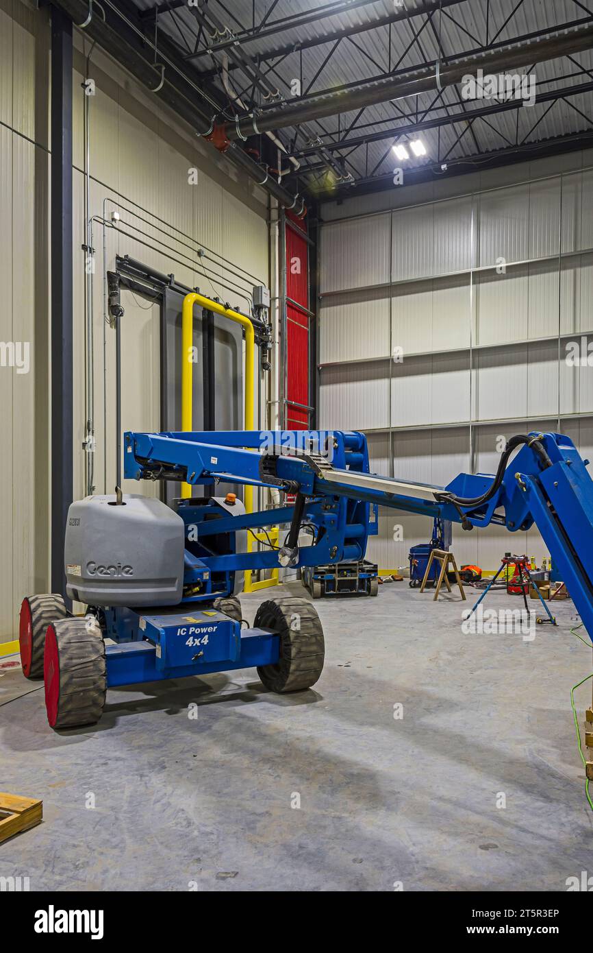 Visible red coolant hoses descend from the roof of a cold-storage ...