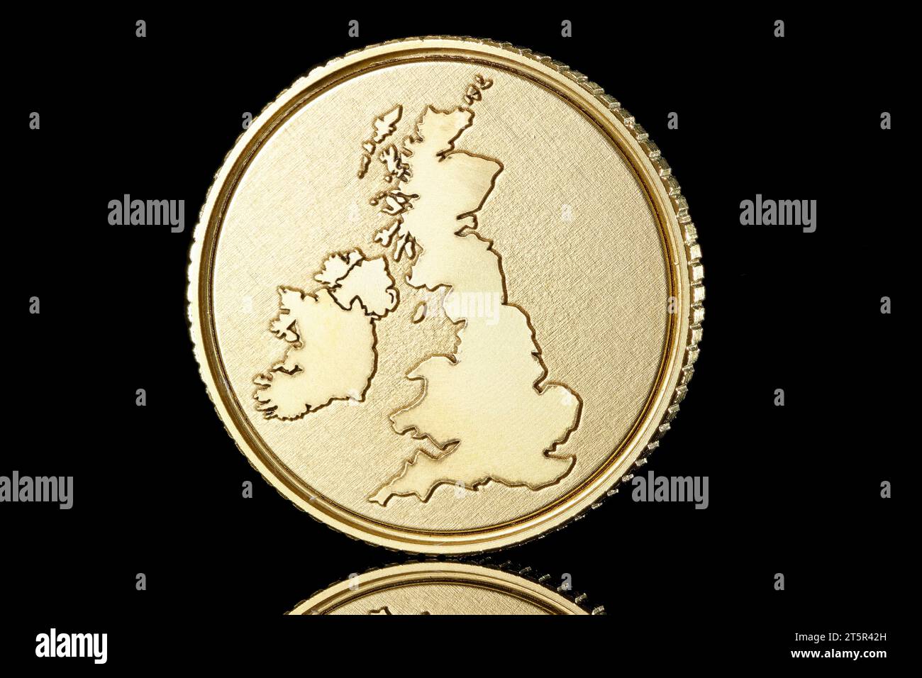 A coin with a map of the United Kingdom design etched onto both sides ...