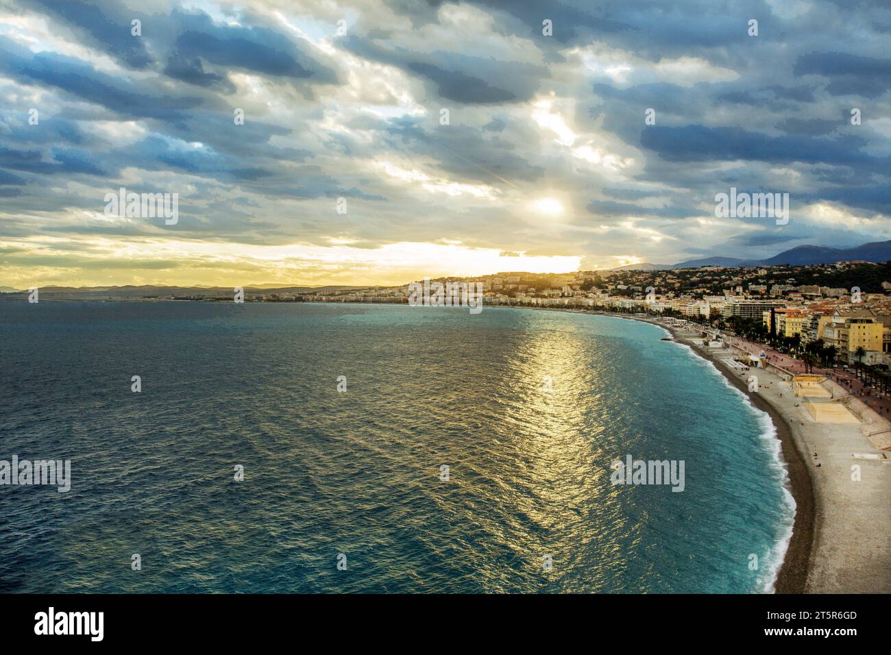 Amazing sunset on Nice city with dramatic sky - yellow sunbeam through ...