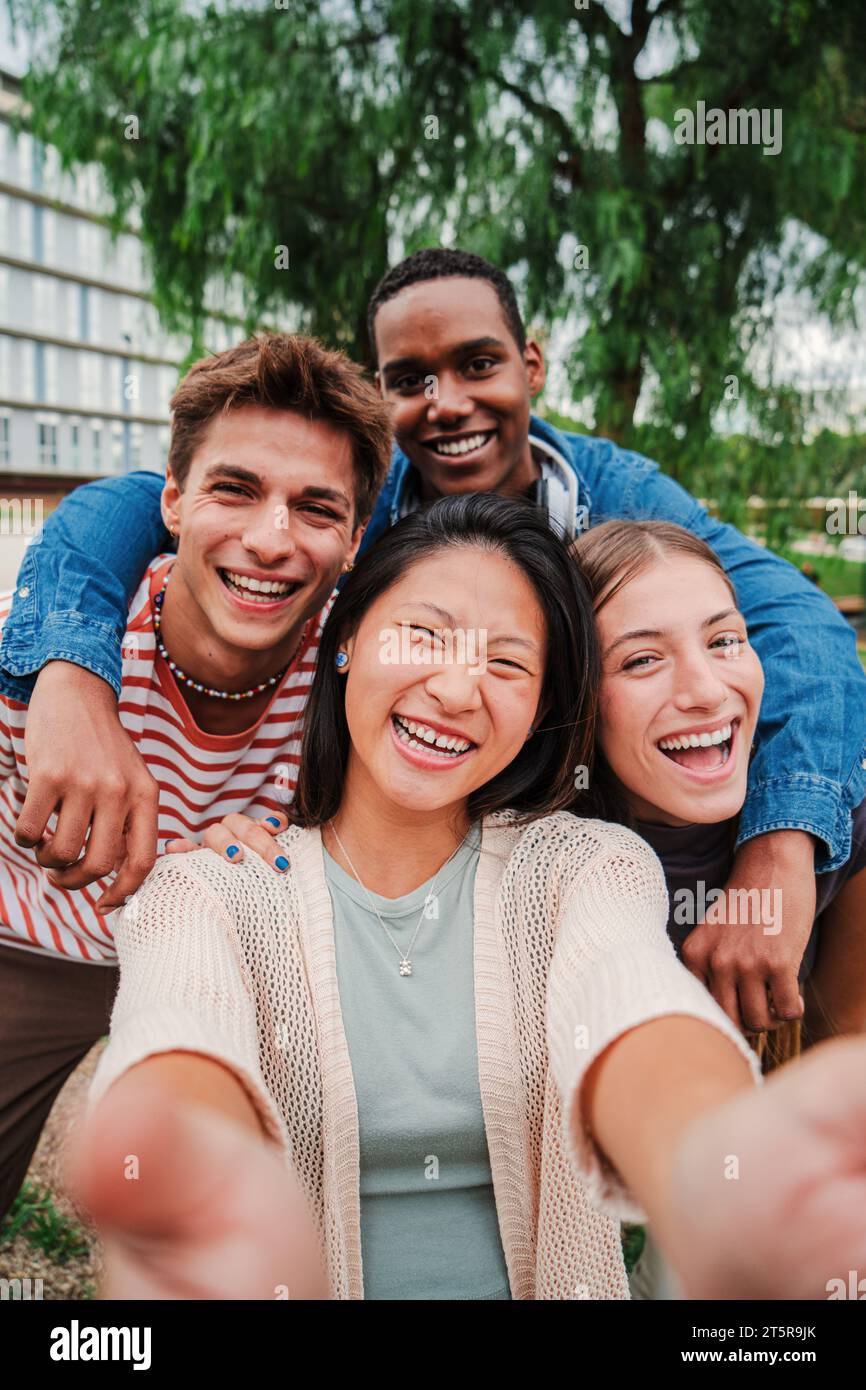 Vertical portrait of a group of young multiracial high school students ...