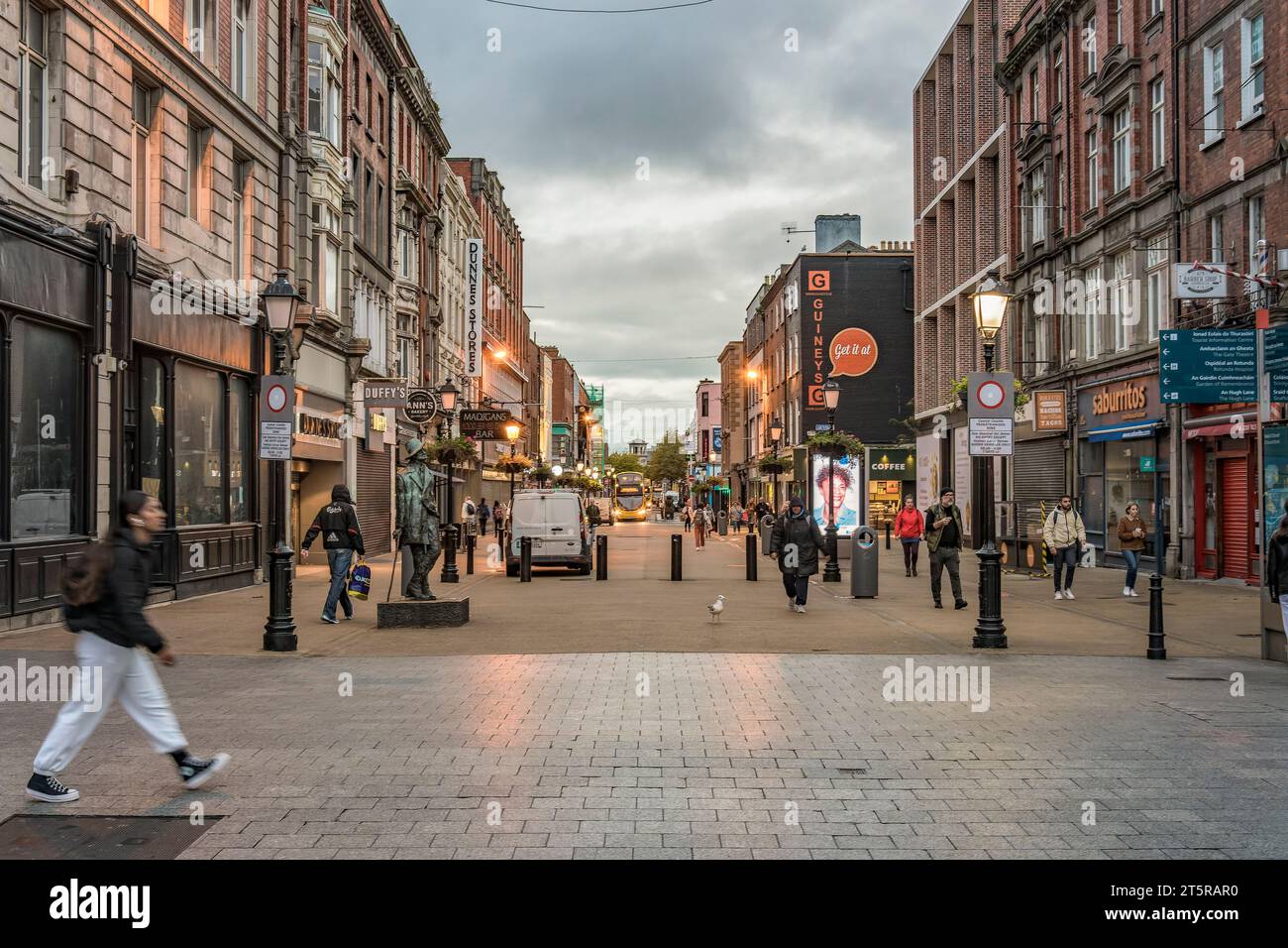 Morning at Talbot Street with James Joyce statue, shops and ...