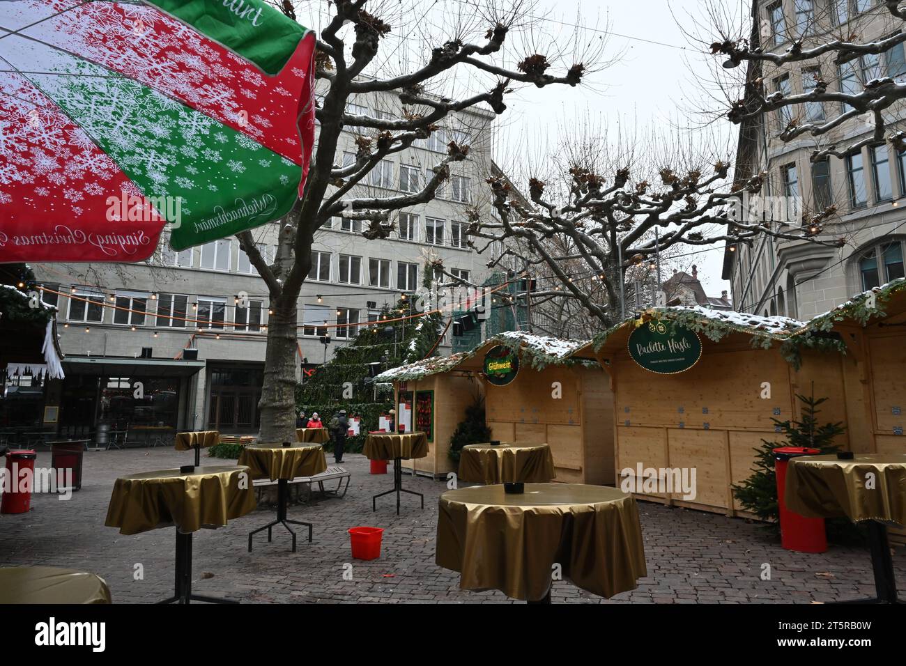 Christmas market in the city center in the morning. The market booths ...