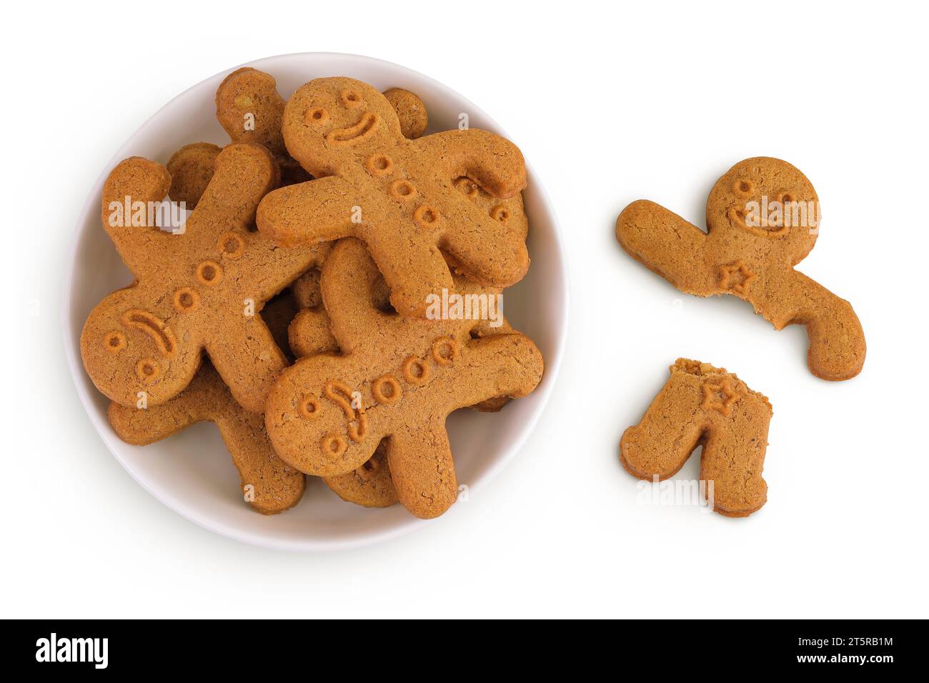 Gingerbread man in ceramic bowl isolated on white background. Top view ...