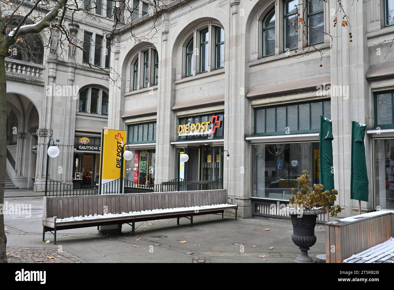 Swiss post building with logo signboard on yellow background with an ...