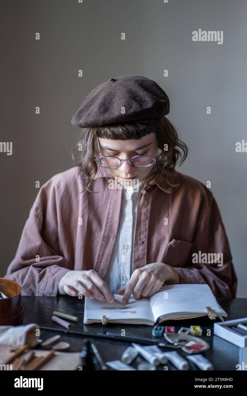 Illustrator creating animation in sketch book with crayons ...