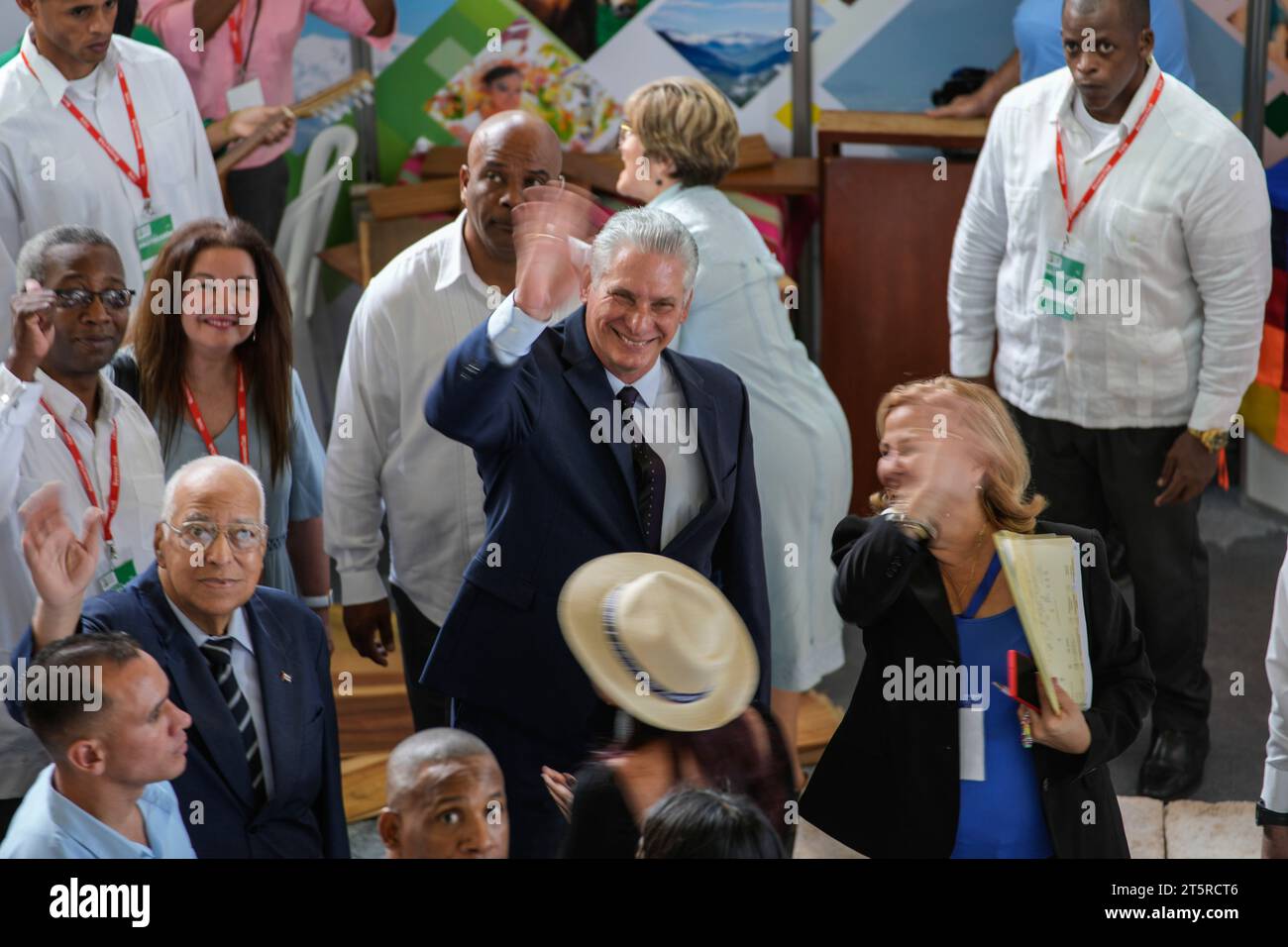Cuba's President Miguel Diaz-Canel, center, waves the opening ceremony ...