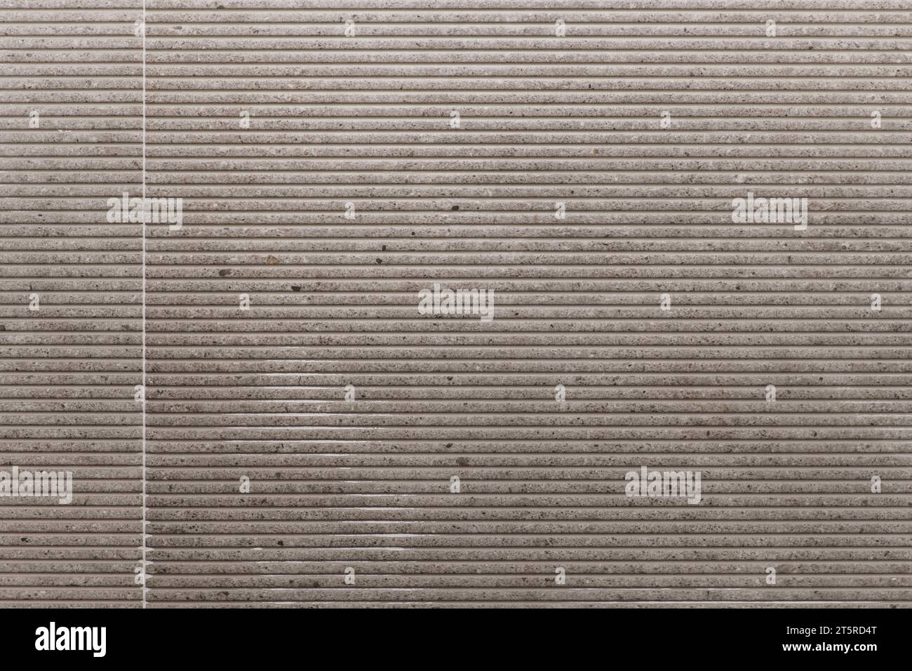 Tiled wall with gray grated tiles Stock Photo - Alamy