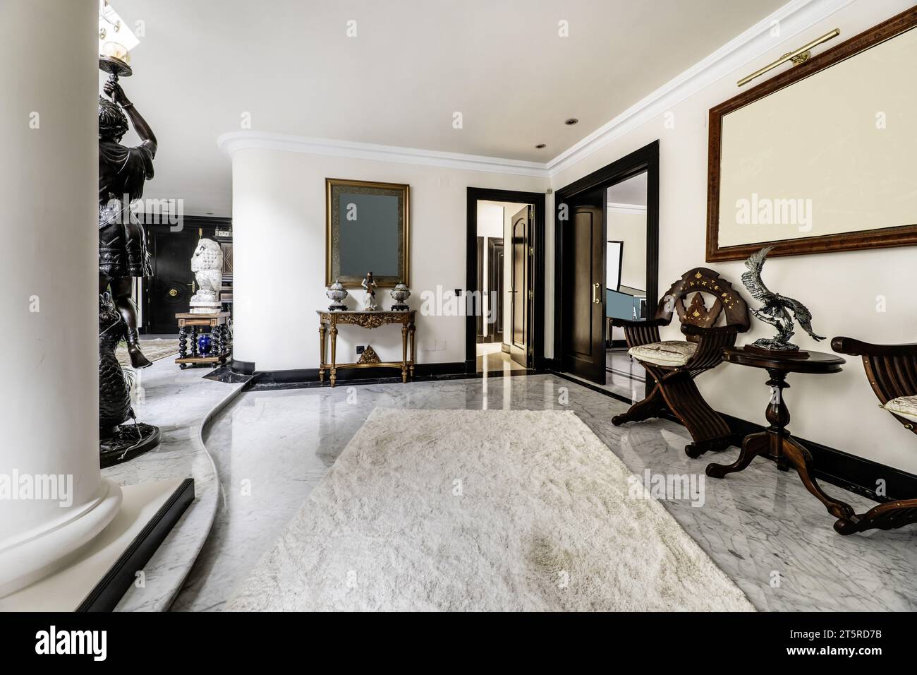 Anteroom of a luxury home with access to several rooms, polished marble ...
