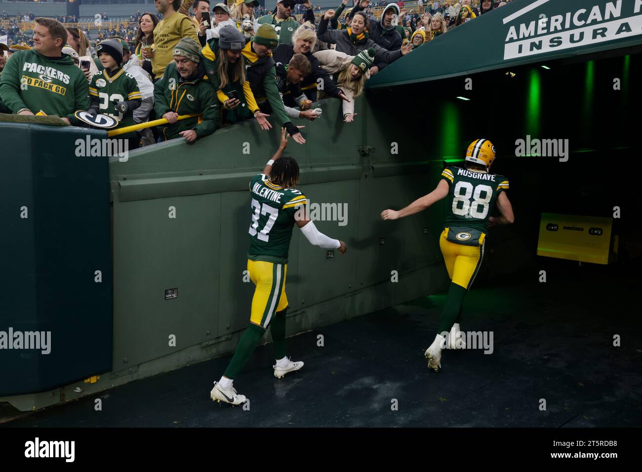 Green Bay Packers cornerback Carrington Valentine (37) and tight end ...