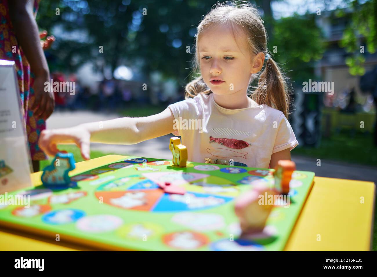 Girl playing board game hi-res stock photography and images - Alamy
