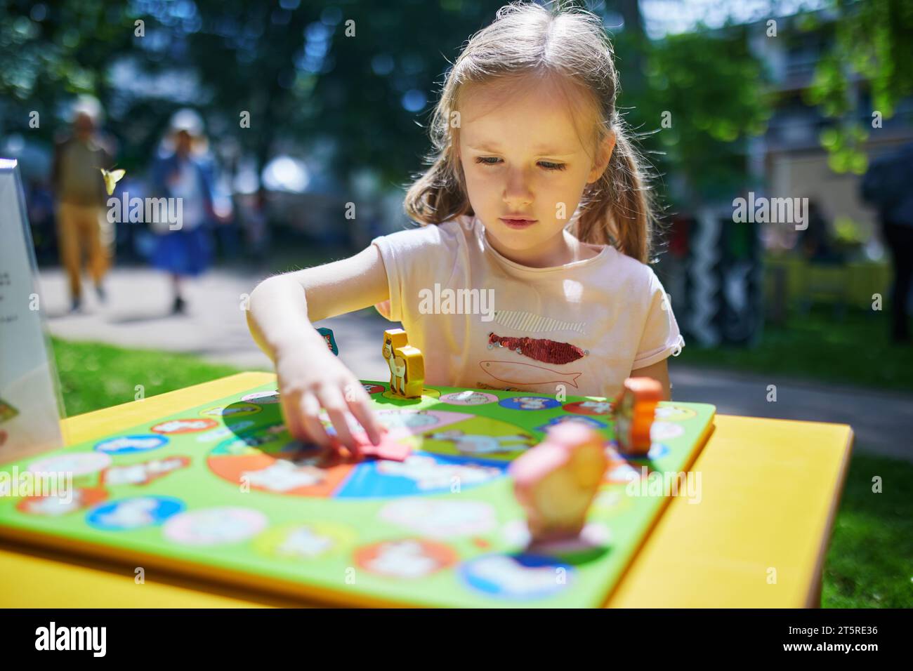 Girl playing board game hi-res stock photography and images - Alamy