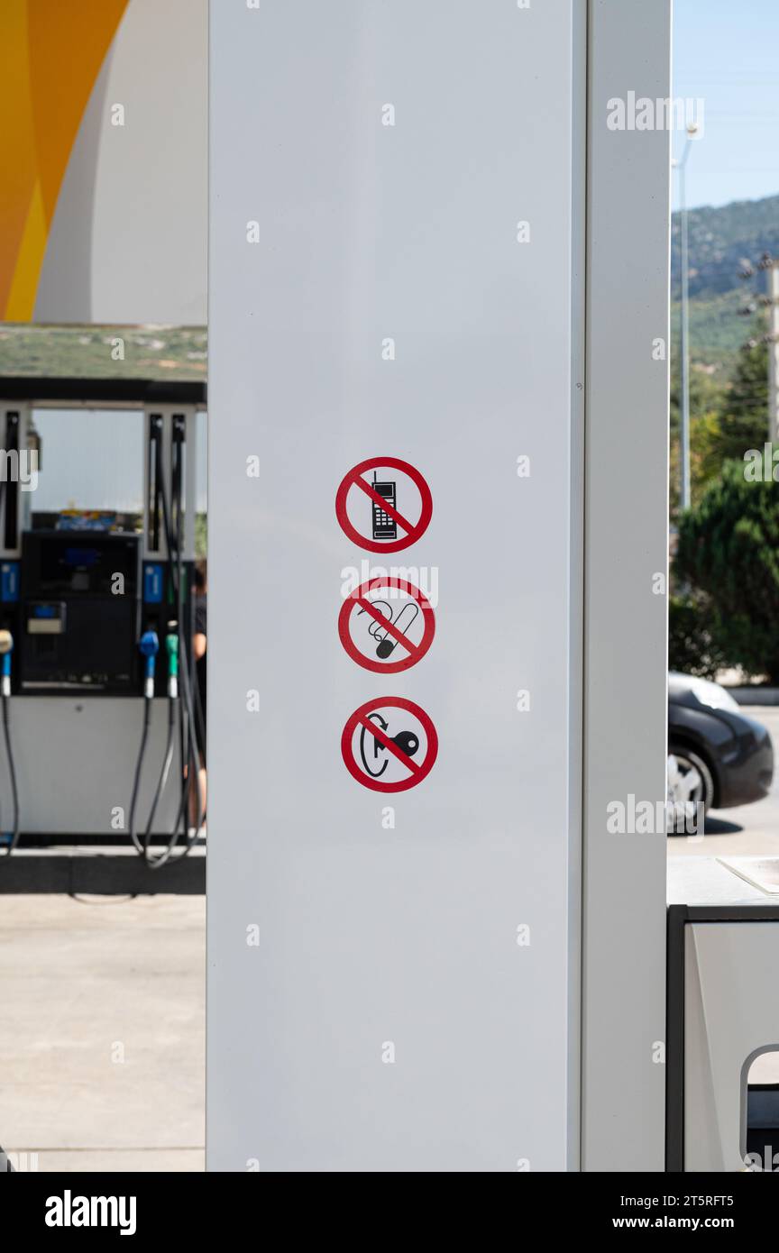 Safety warning signs at the petrol station Stock Photo - Alamy