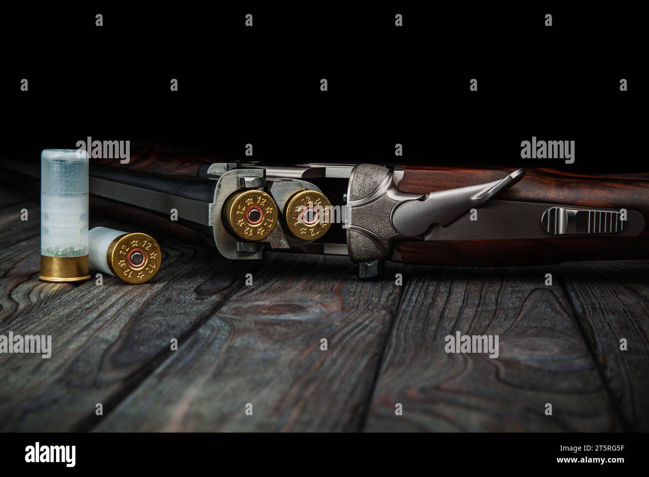 Classic trigger double-barreled hunting rifle on a wooden background ...