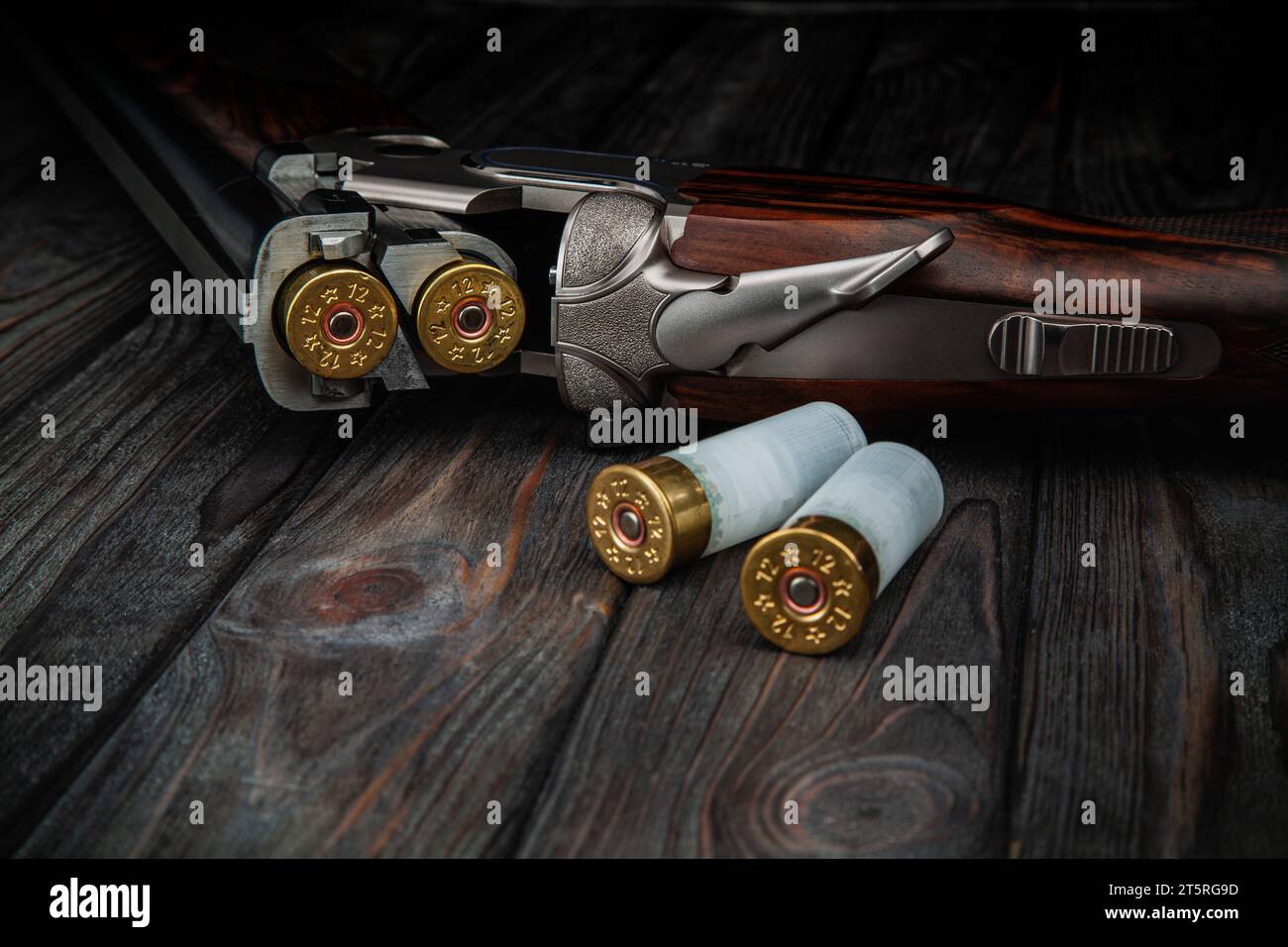Classic trigger double-barreled hunting rifle on a wooden background ...