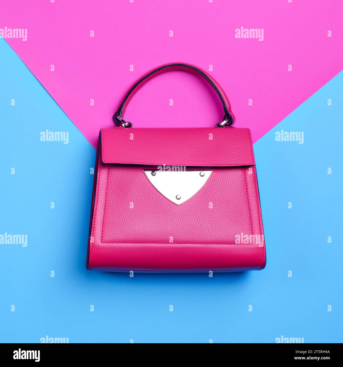 Modern female top-handle bag made of red leather with silver metal ...