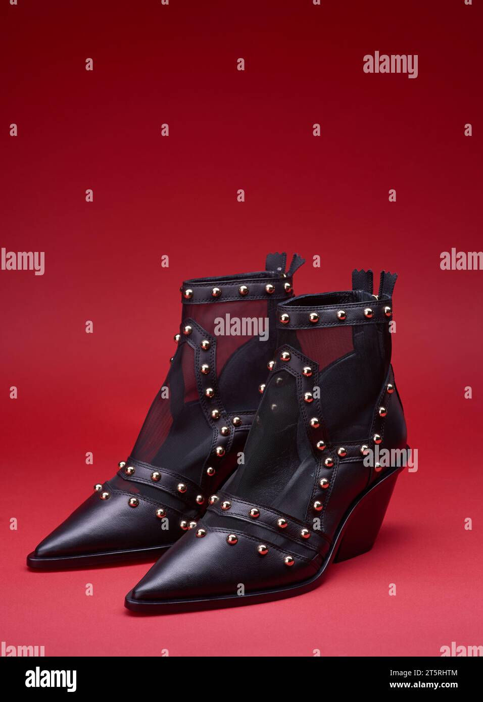 Extravagant black female leather pointed-toe boots with riding heels ...