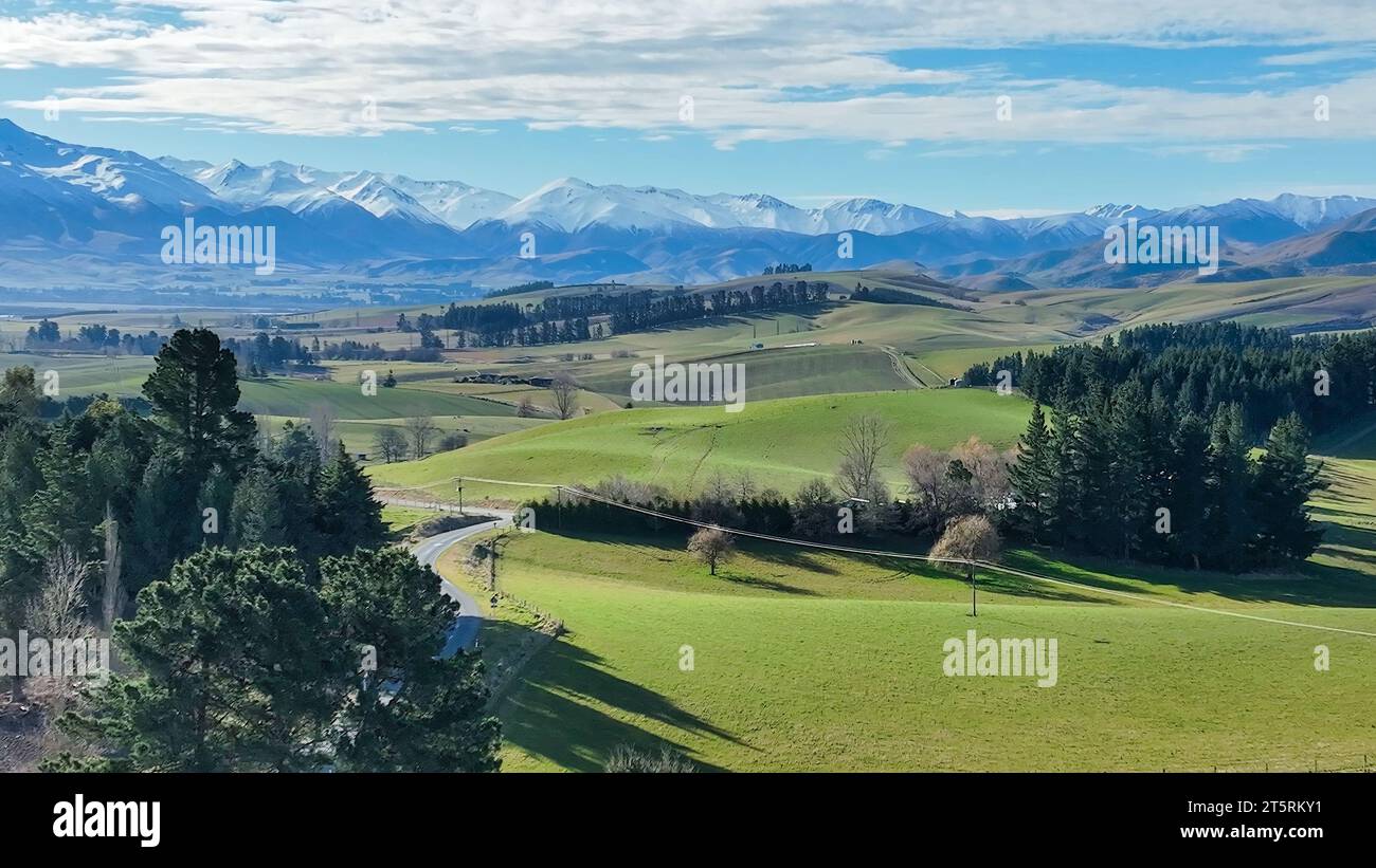 Panoramic aerial views of mountain ranges and rolling hills and valleys ...