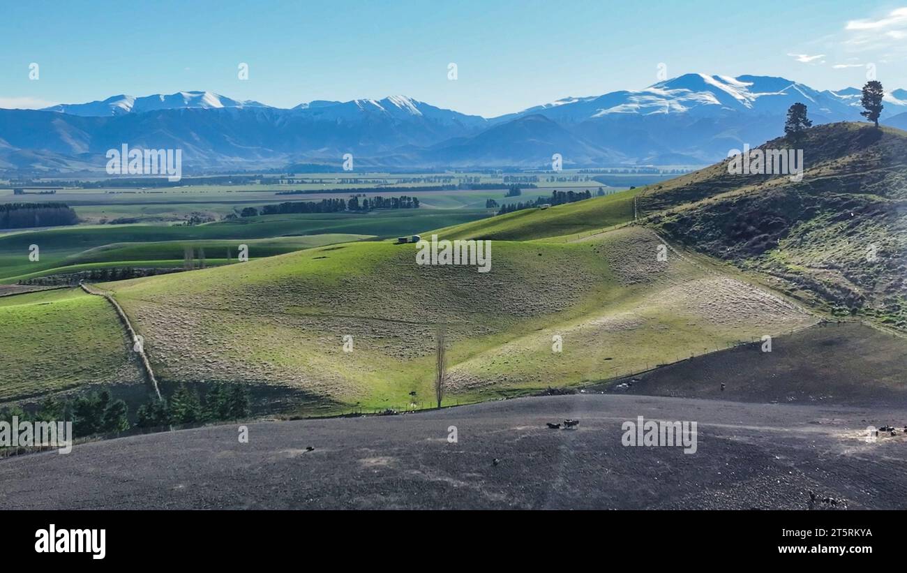 Panoramic aerial views of mountain ranges and rolling hills and valleys ...