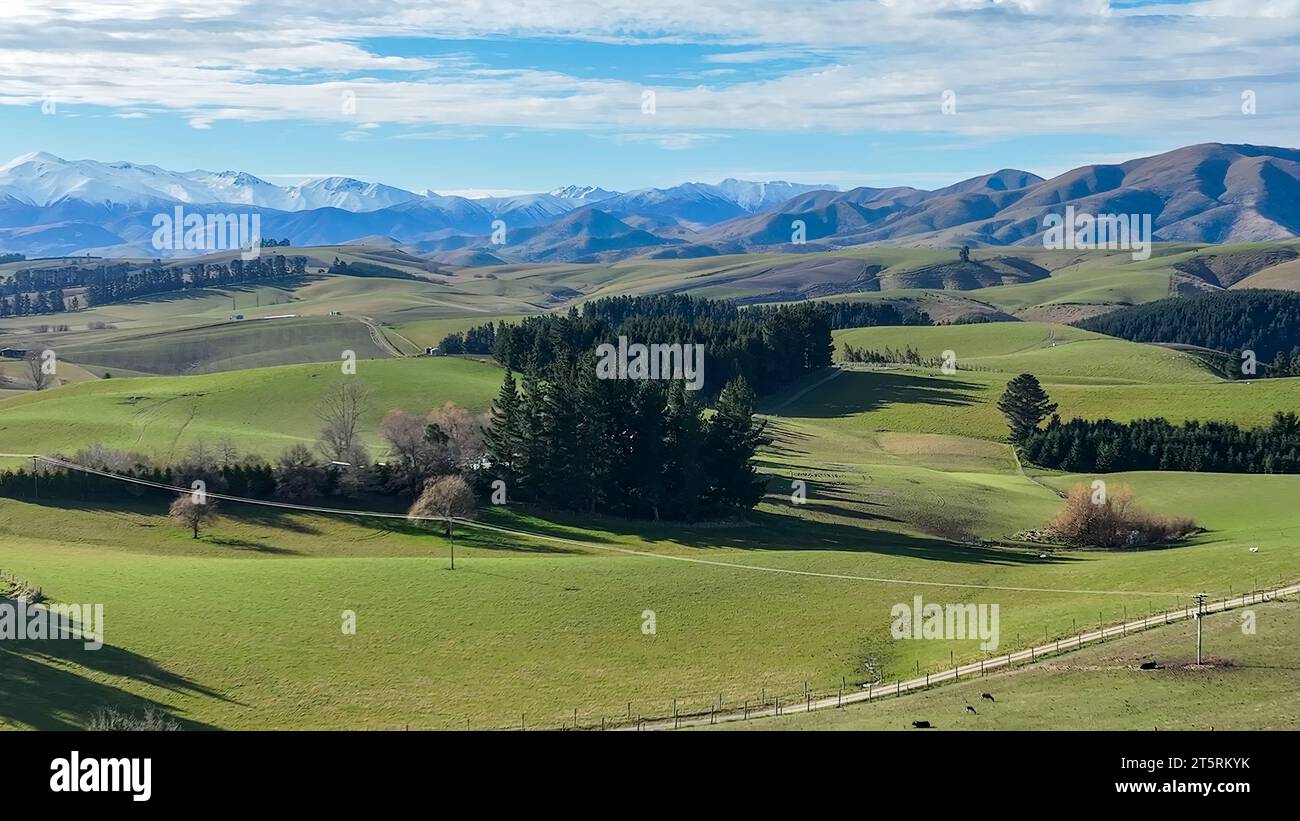 Panoramic aerial views of mountain ranges and rolling hills and valleys ...