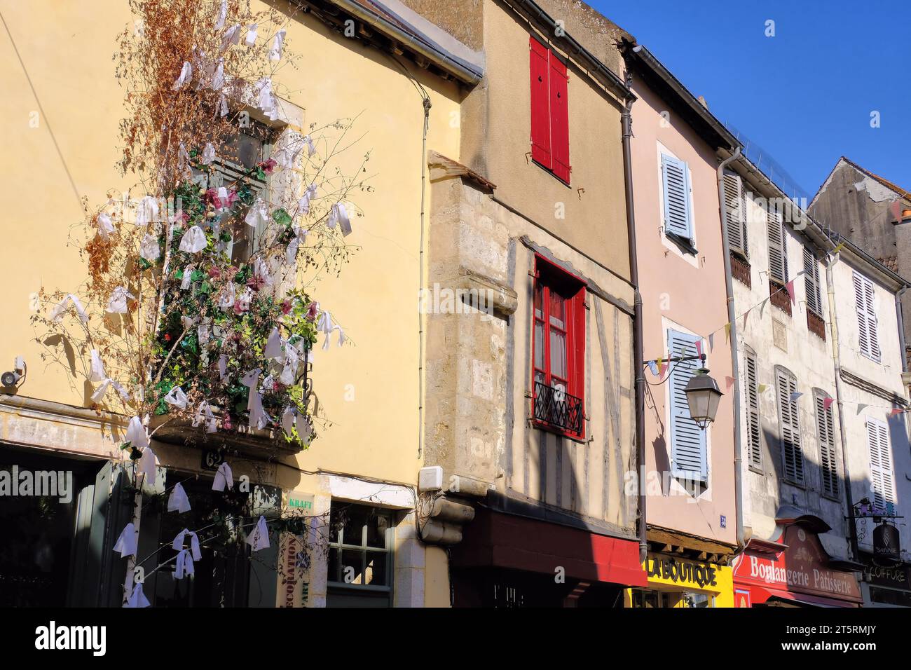 Avallon: Colourful shops with decorations in Grande Rue Aristide Briand ...